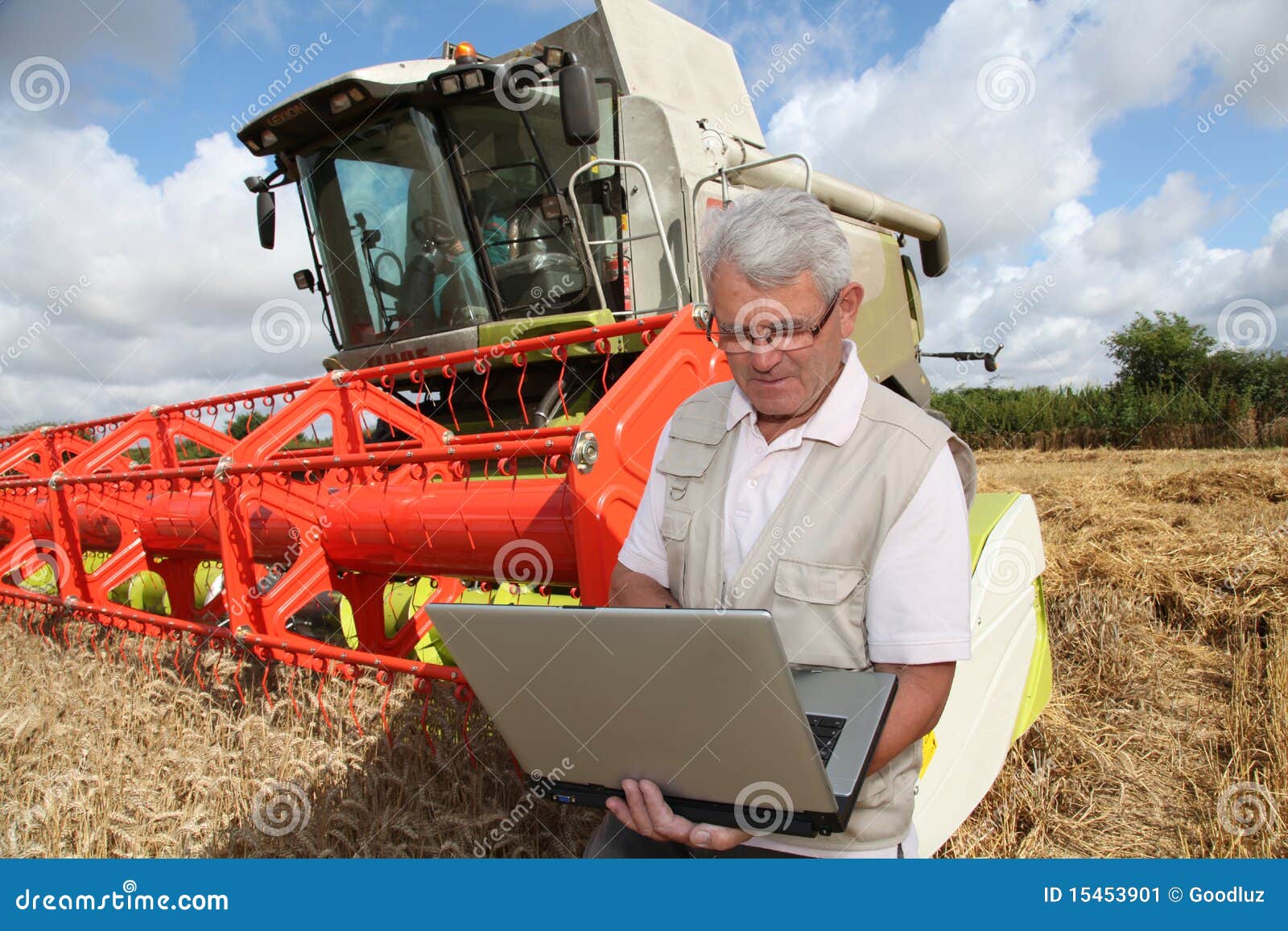 Farmer Standing by Harvester Stock Image - Image of outdoors, tractor ...