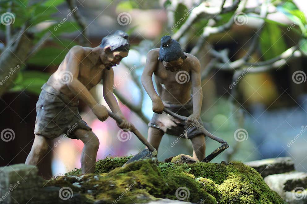Farmer statue digging stock image. Image of primate - 263302993