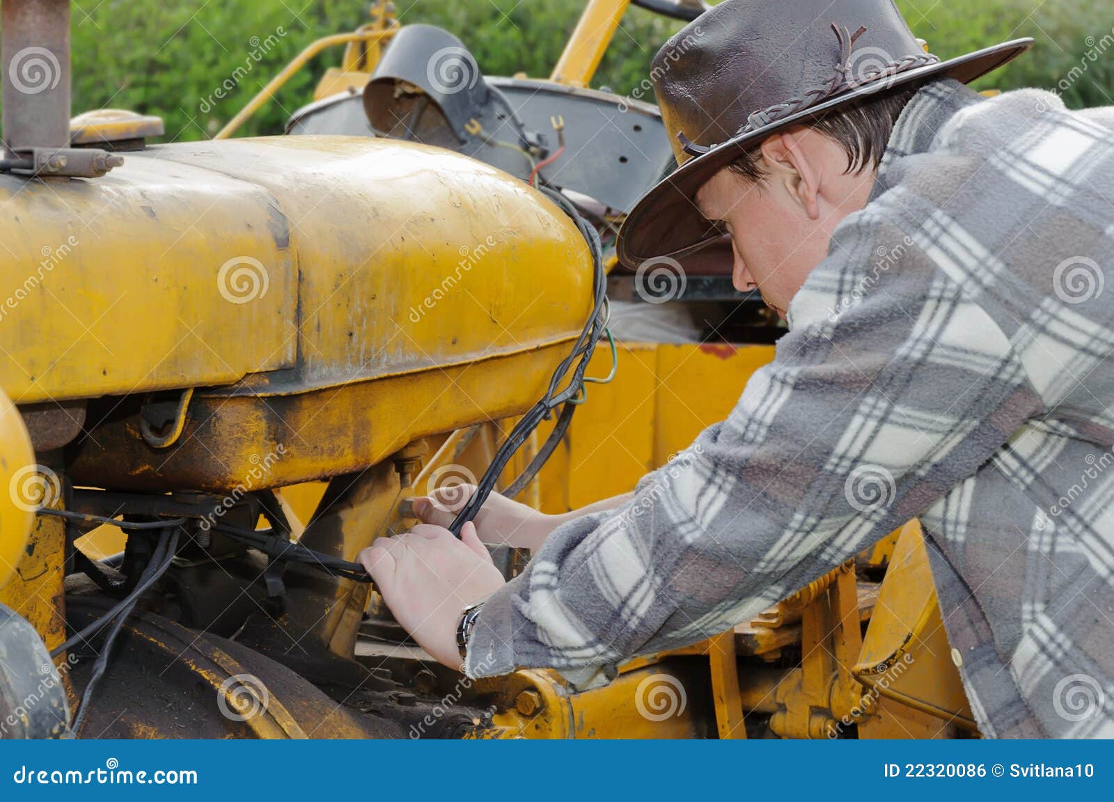 Farmer on the Tractor Fixing Stock Photo - Image of field, nature: 22320086