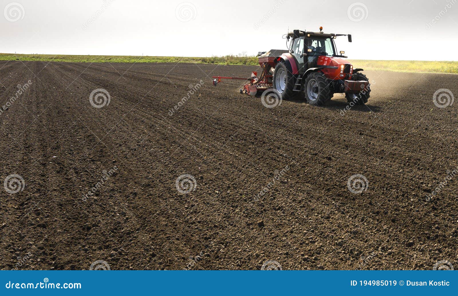 Farmer with Tractor Seeding Crops at Field Stock Image - Image of ...