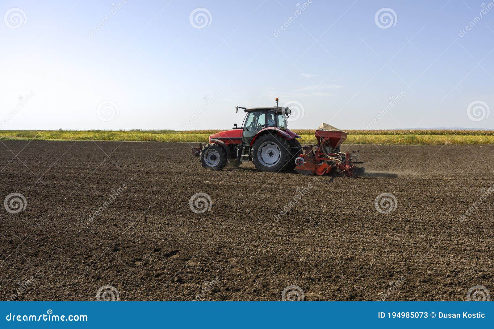 Farmer with Tractor Seeding Crops at Field Stock Image - Image of ...