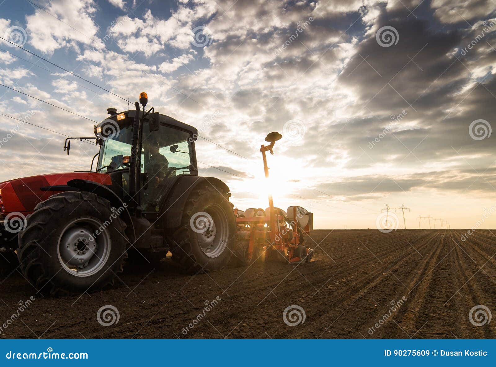 Farmer with Tractor Seeding - Sowing Crops at Agricultural Field Stock ...