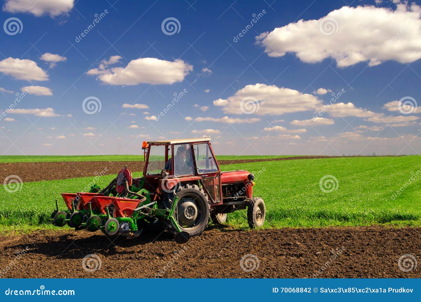 Farmer with Tractor Sowing on Agricultural Fields in Spring Stock Photo ...
