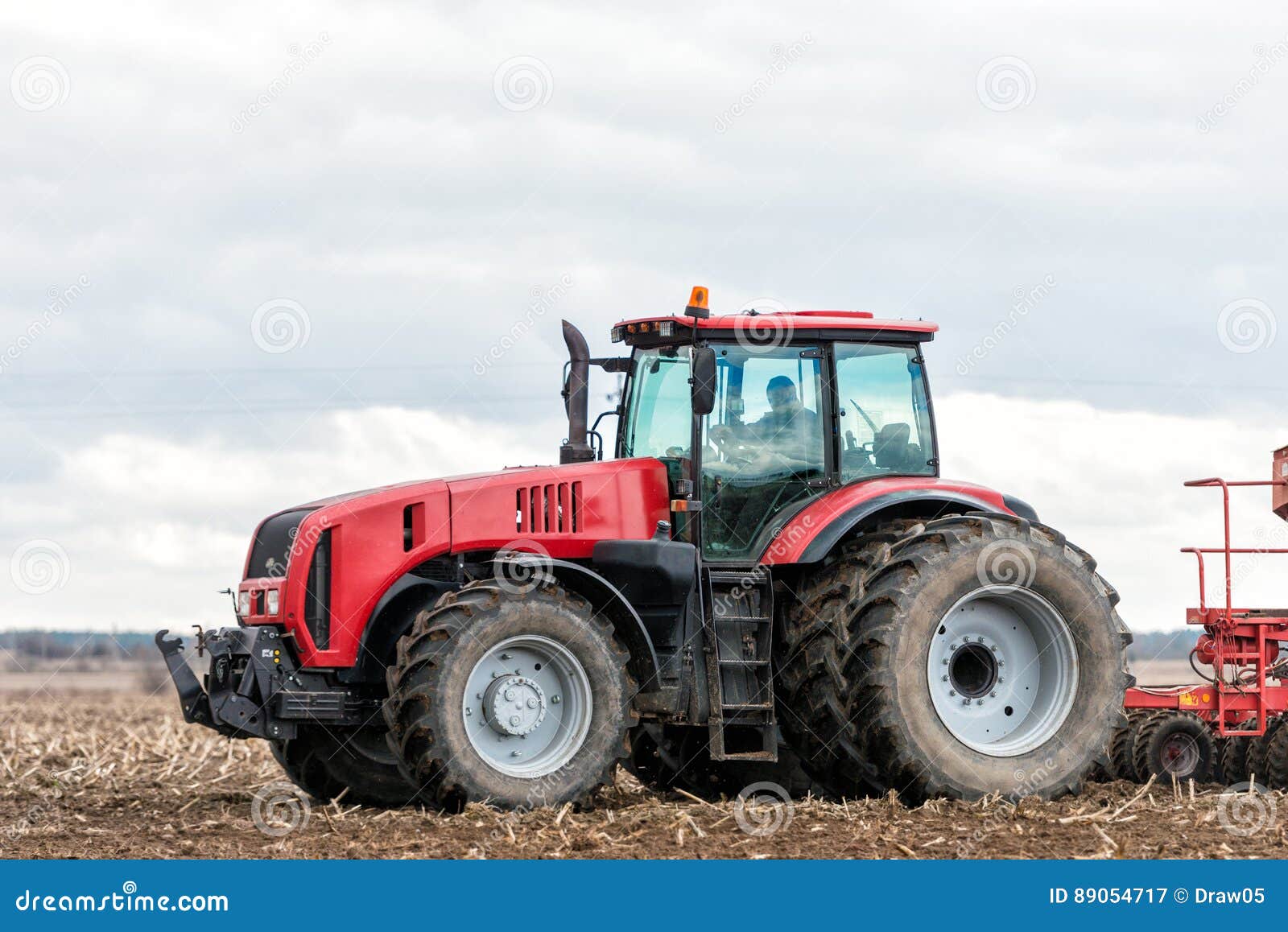 Farmer Tractor Working in the Field. Spring Time for Sowing Stock Image ...
