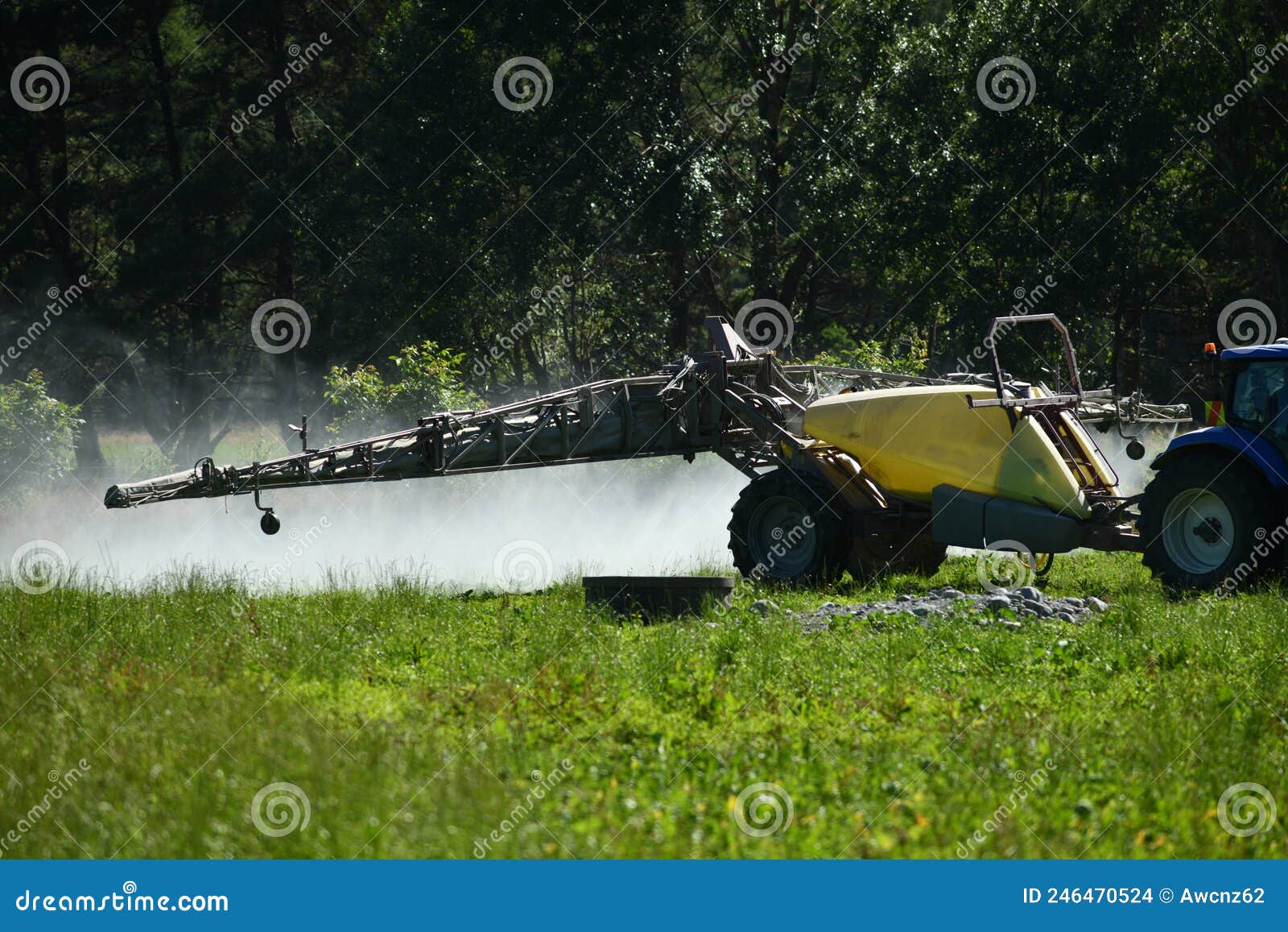 A Farmer Uses a Large Sprayer Stock Photo - Image of mist, farming ...