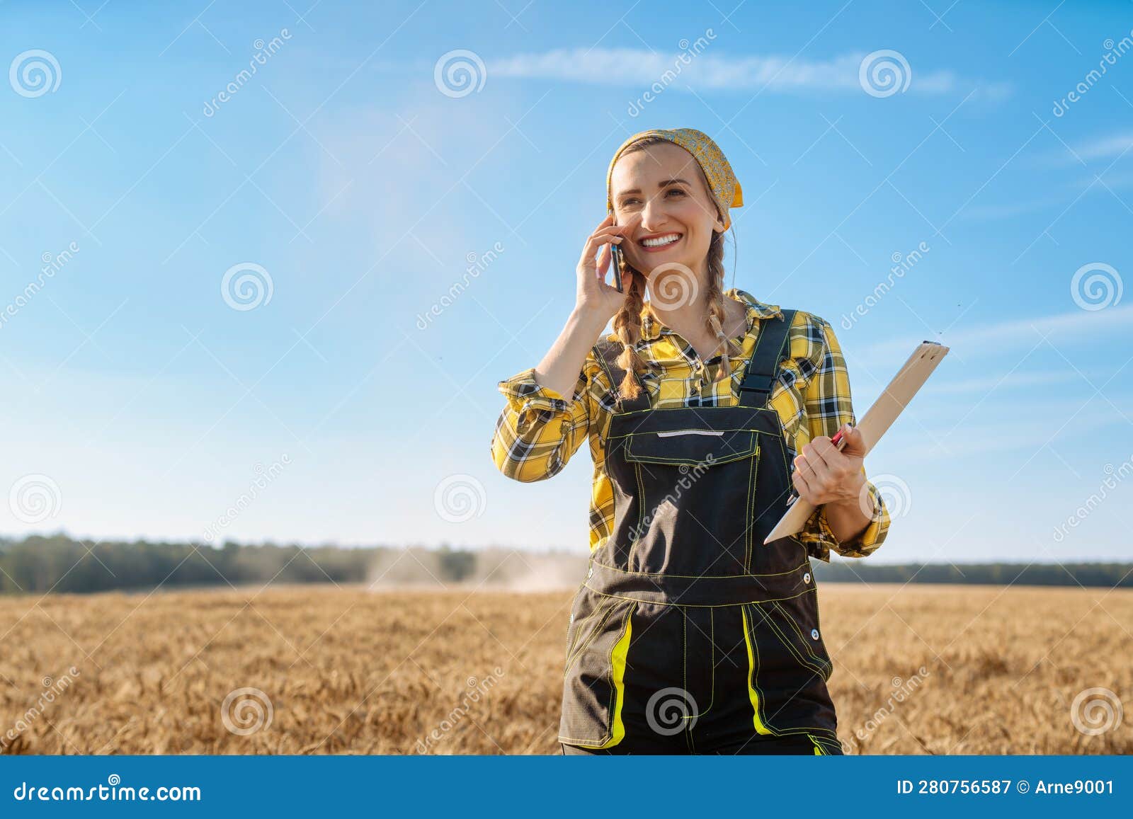 Farmer Using Her Phone on a Grain Field Stock Image - Image of ...