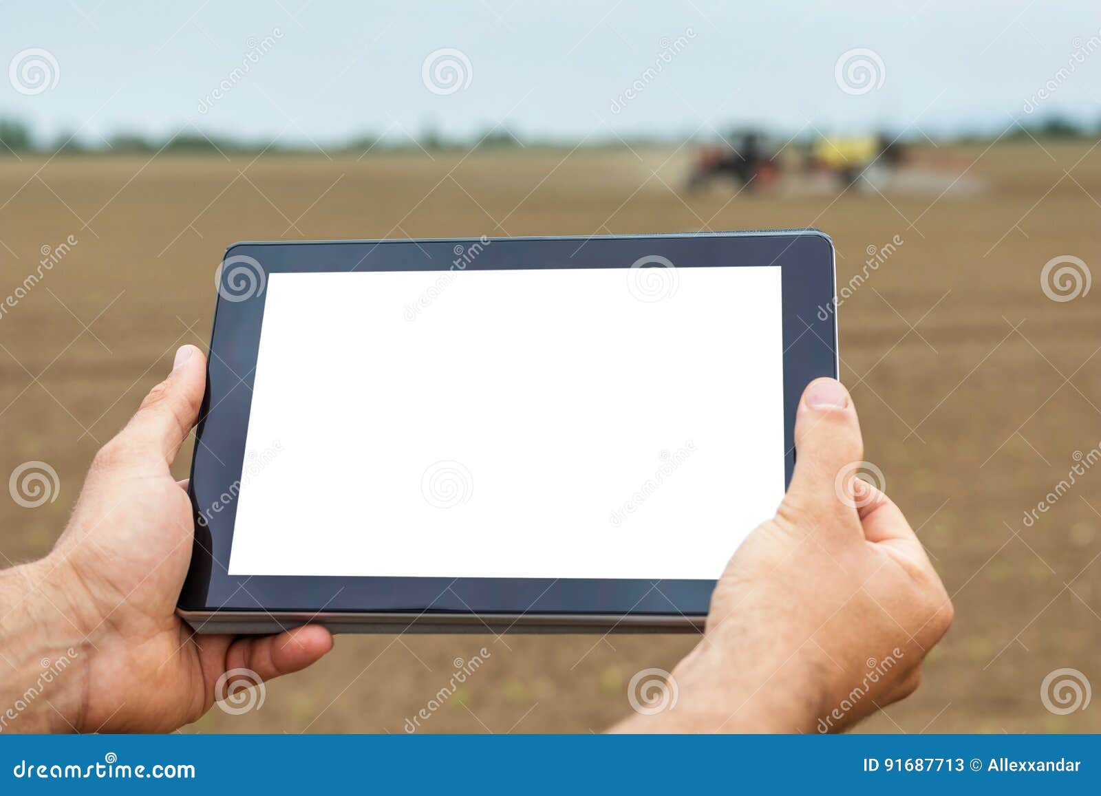 Farmer Using Tablet Computer in Agricultural Cultivated Field. W Stock ...