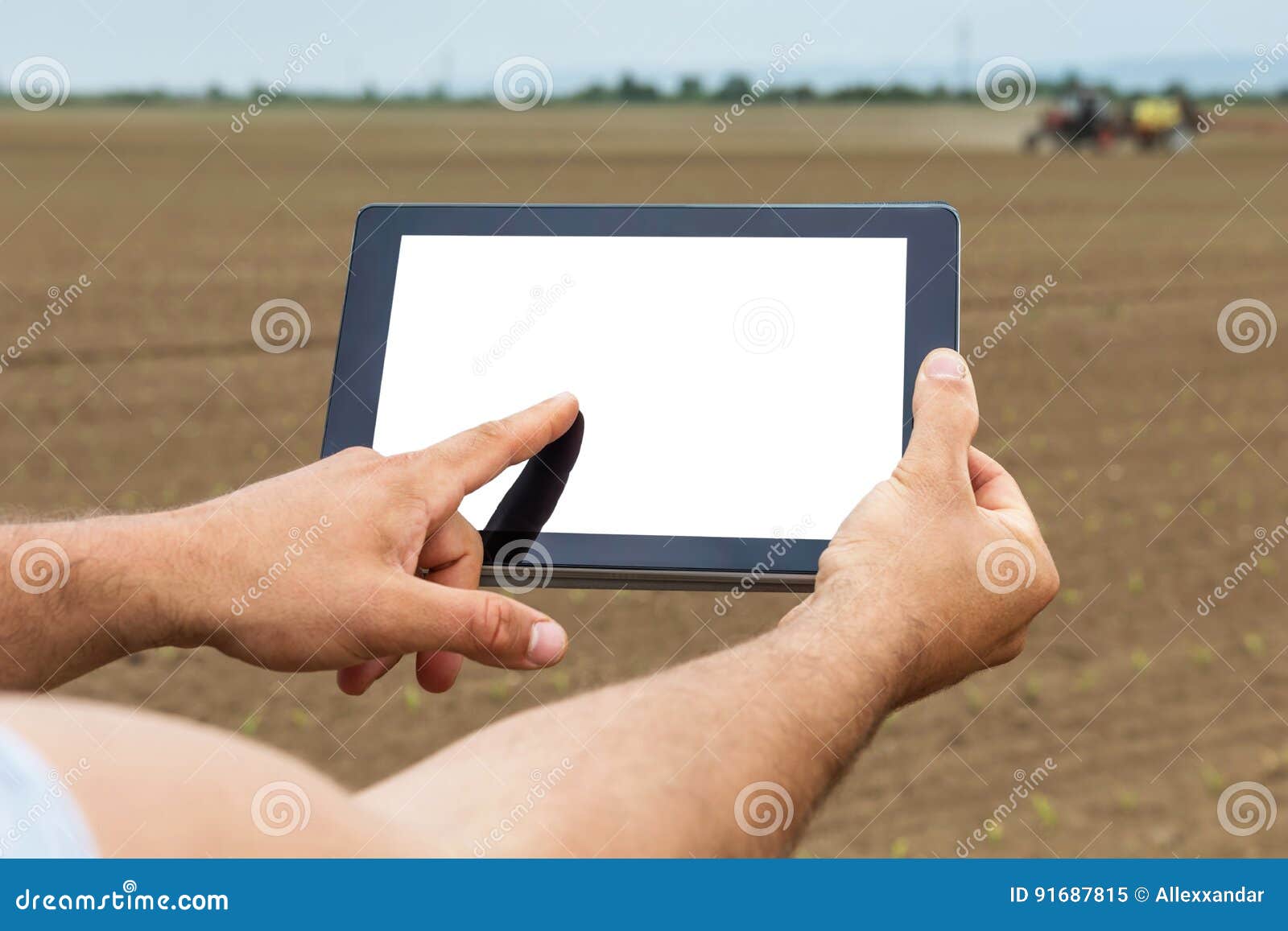 Farmer Using Tablet Computer in Agricultural Cultivated Field. W Stock ...