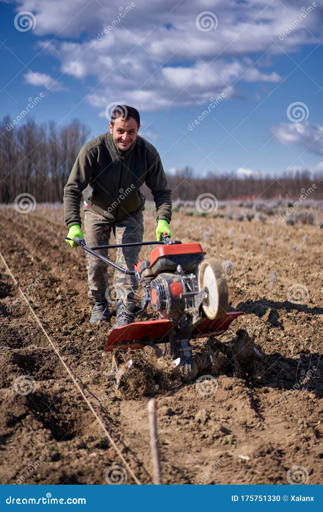 Farmer Weeding the Field with a Tiller Stock Photo - Image of field ...