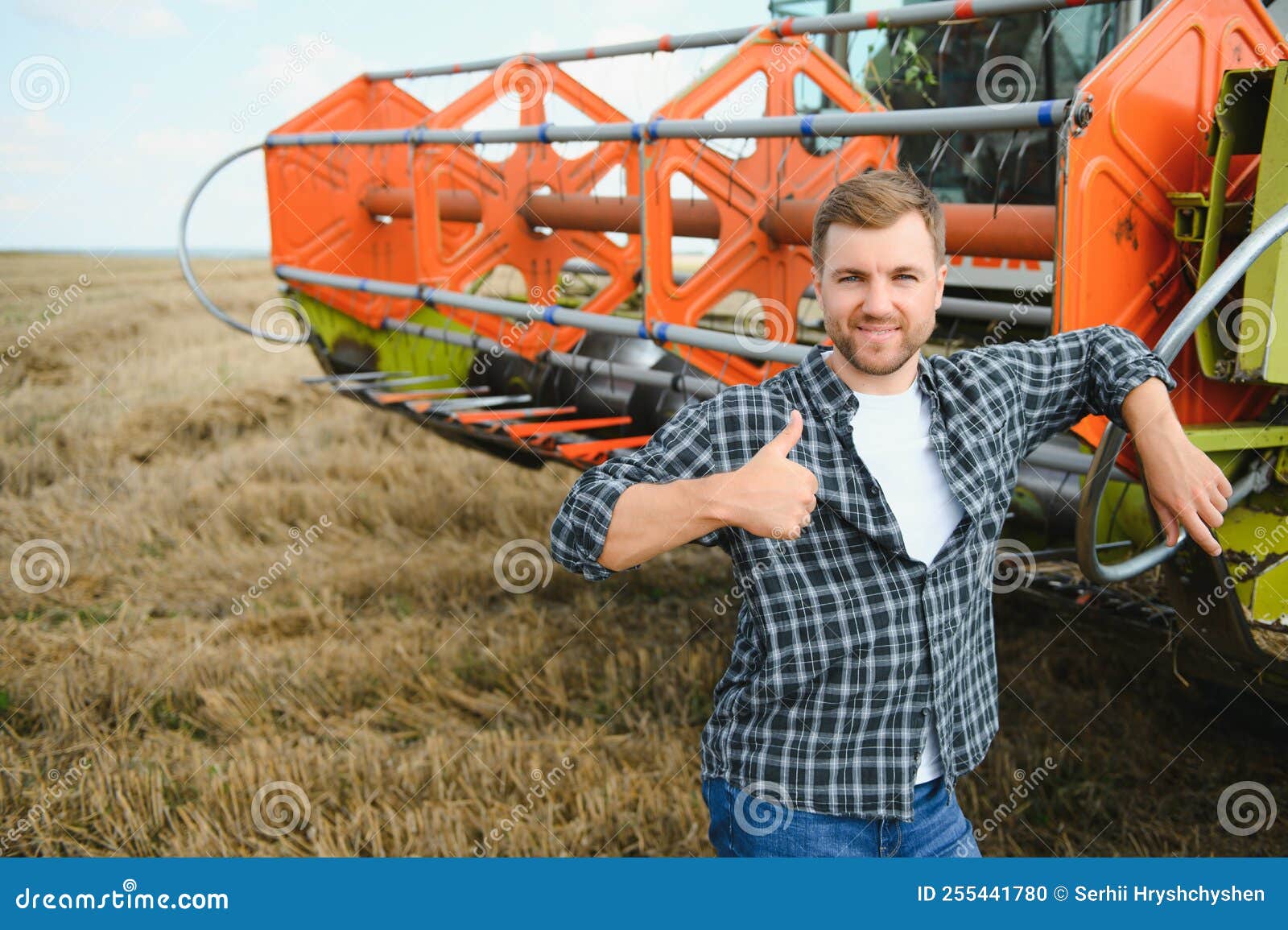 Farmer in Wheat Field with Harvester. Stock Photo - Image of cultivated ...