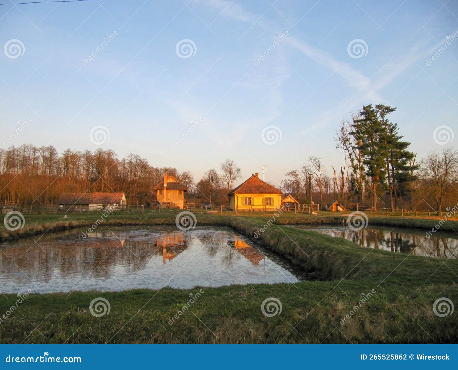 Farmhouse with a Fish Pond and Sunset Rays Stock Photo - Image of ...