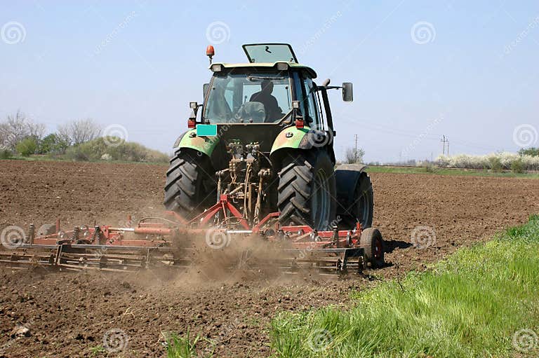Farming a Field with a Tractor Stock Photo - Image of metal, cabin ...