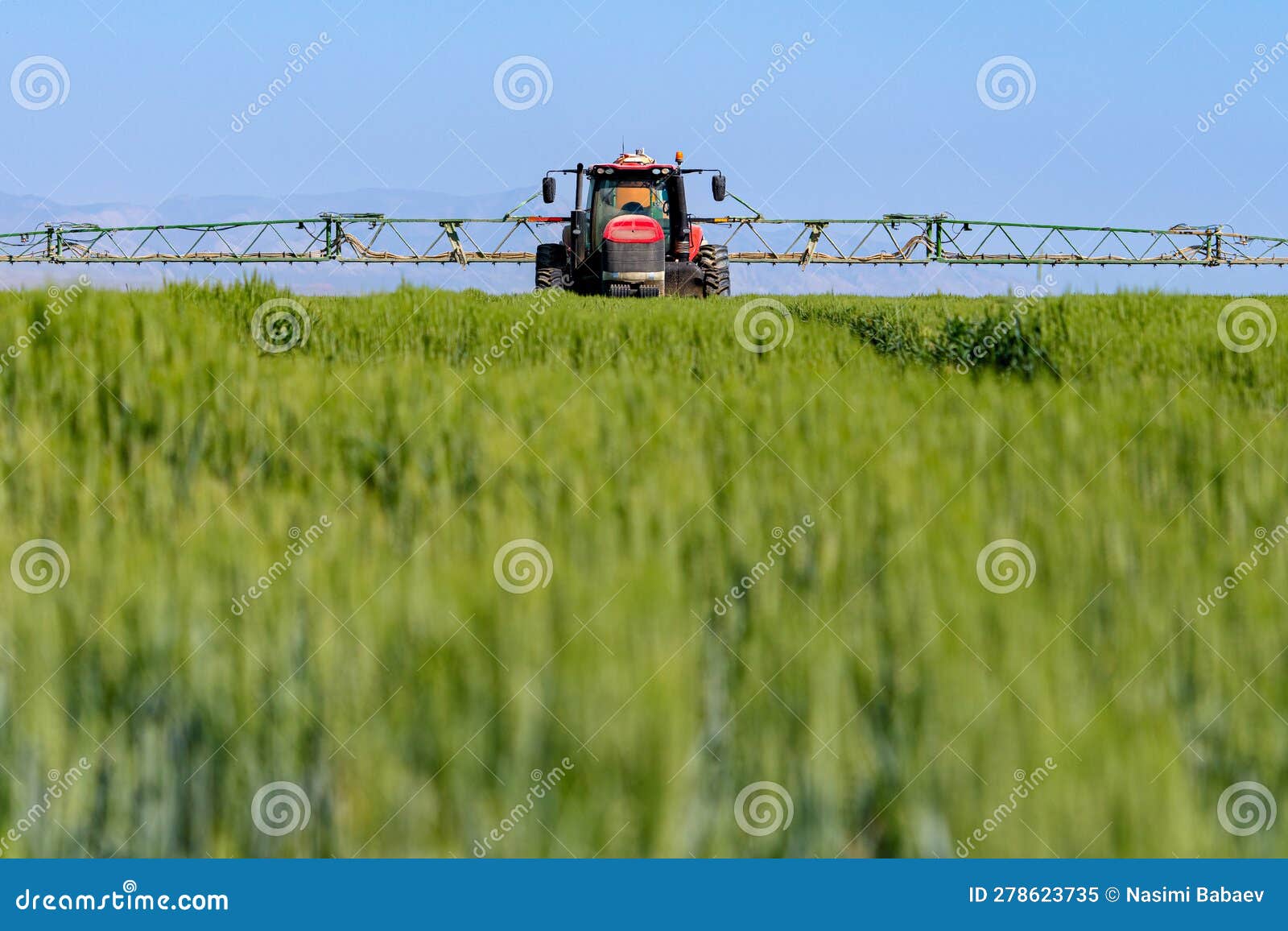 Farming Tractor Plowing and Spraying on Field. Stock Image - Image of ...