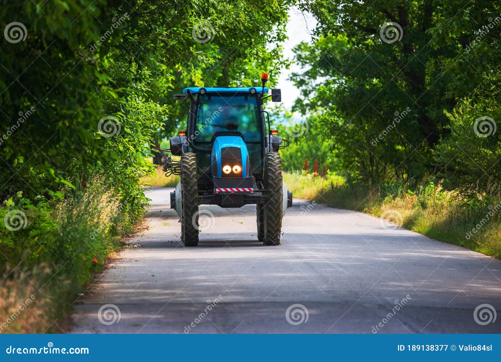 Farming Tractor on the Road Stock Image - Image of harrow, dust: 189138377
