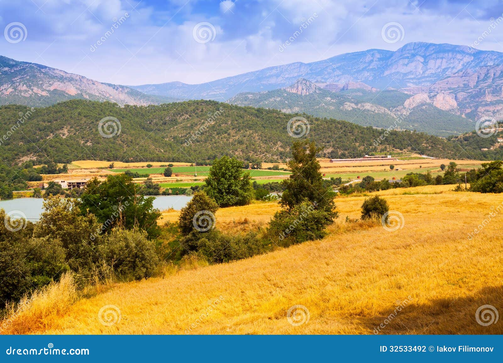 Farms and fields in valley stock photo. Image of oliana - 32533492
