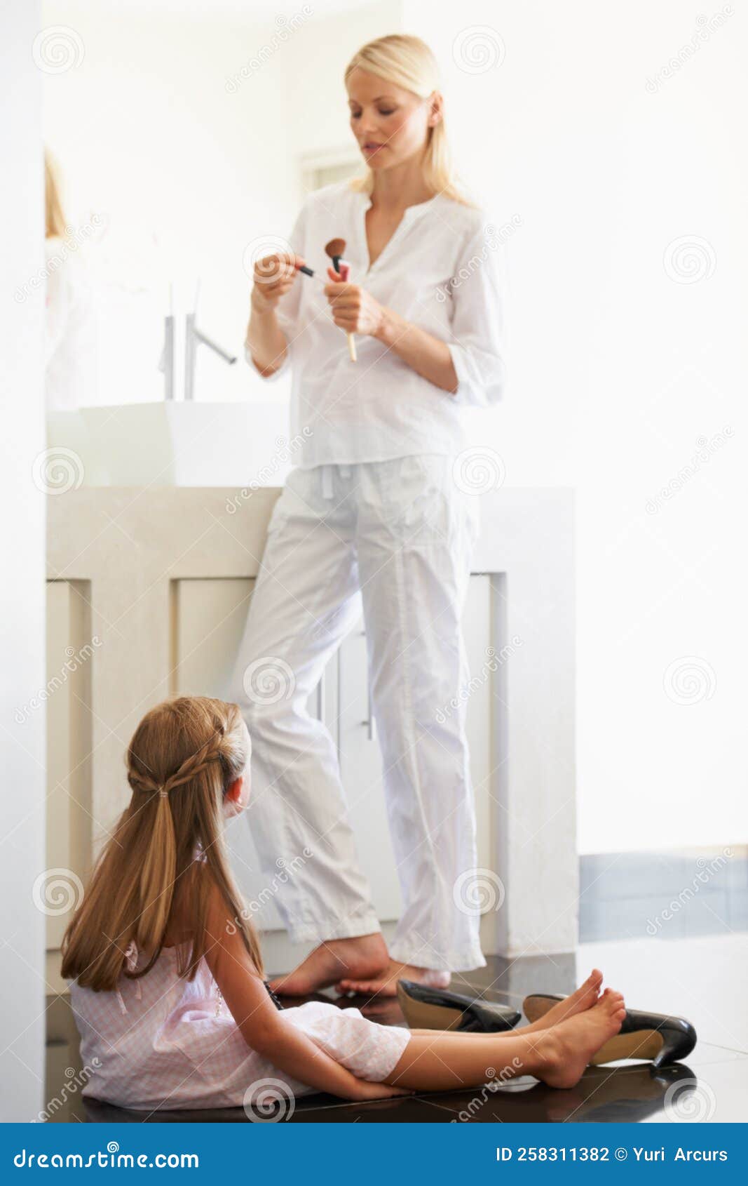 Fascinated by Her Mother. Little Girl Watching Her Mother Get Ready ...