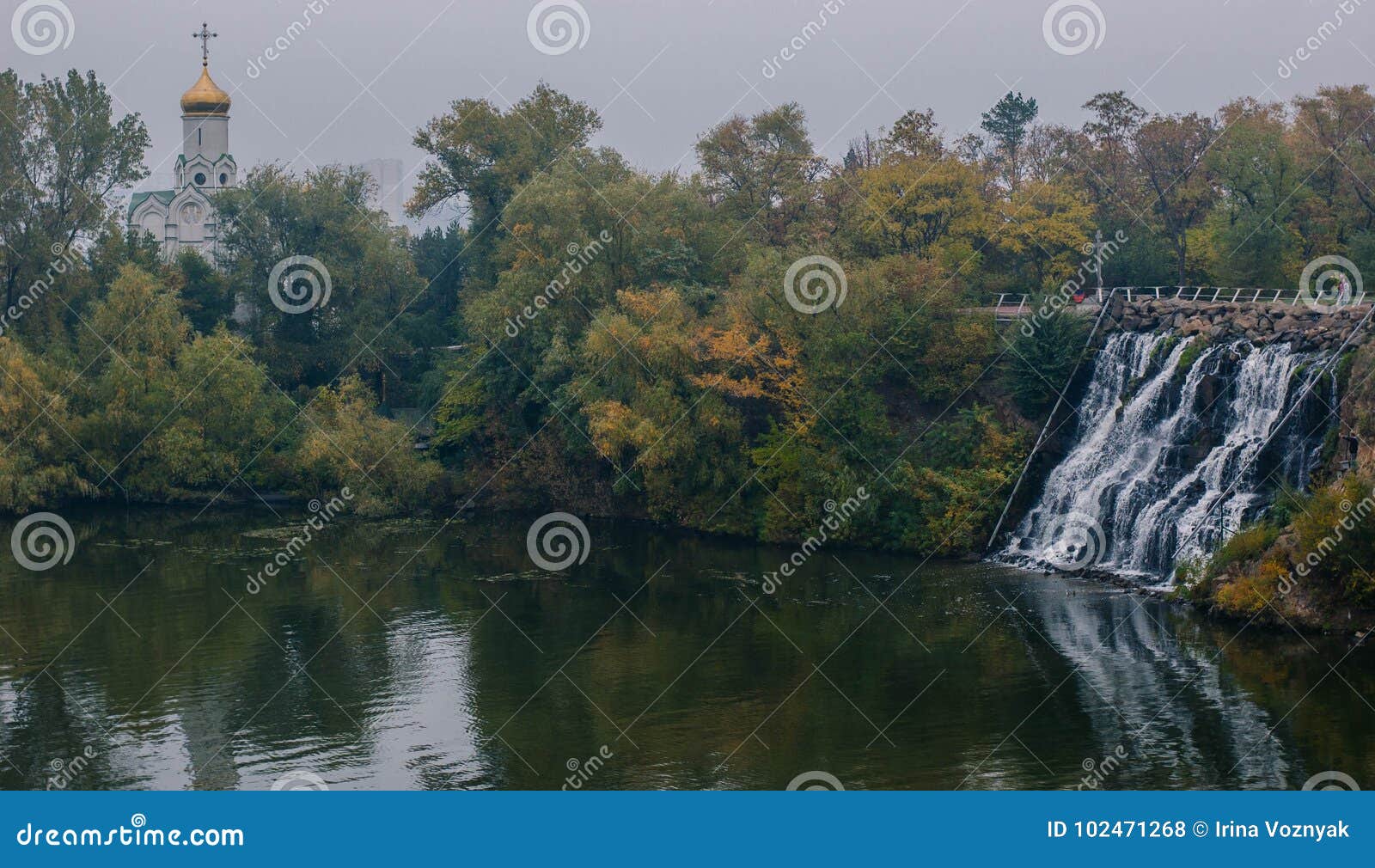 A Fascinating Landscape of a Waterfall and a Church Stock Photo - Image ...
