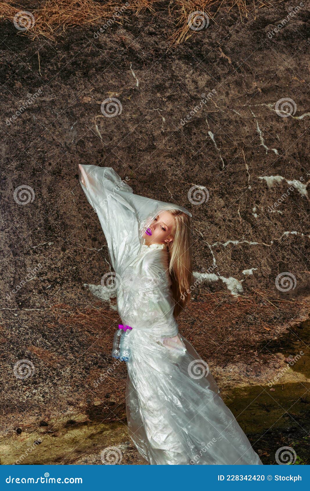 Fashion Creative. Model Posing in Cellophane with Plastic Bottles Stock ...