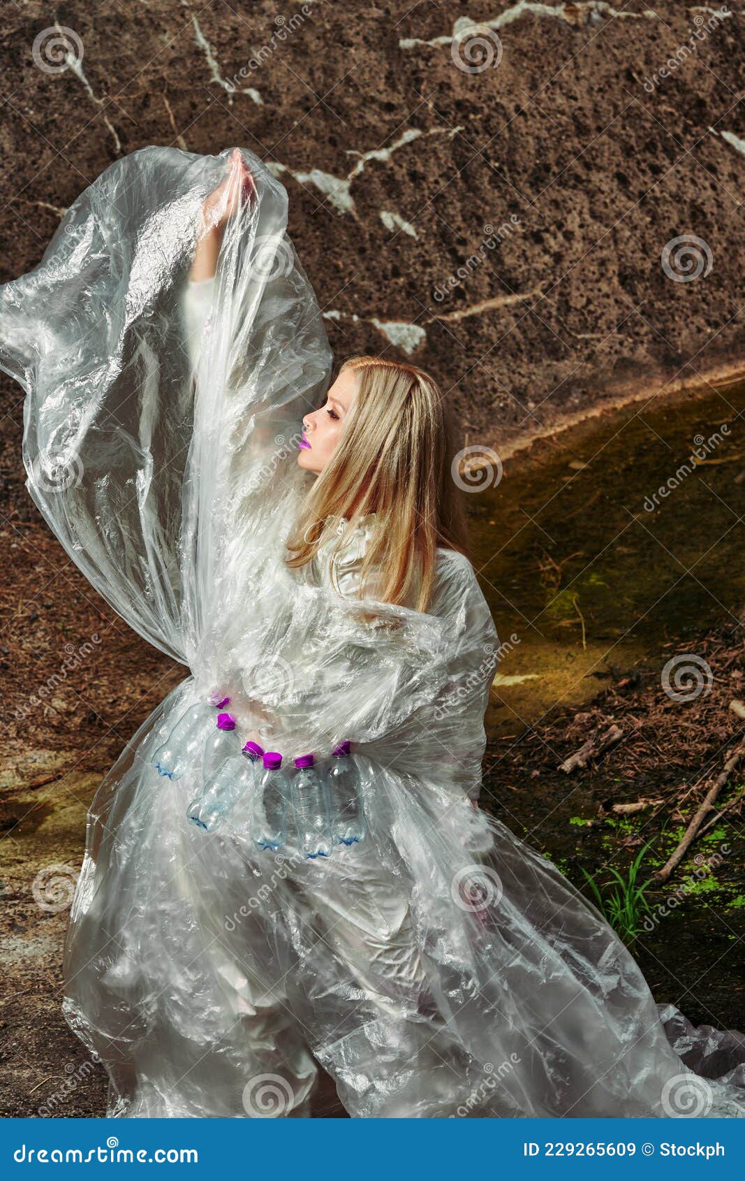 Fashion Creative. Model Posing in Cellophane with Plastic Bottles Stock ...