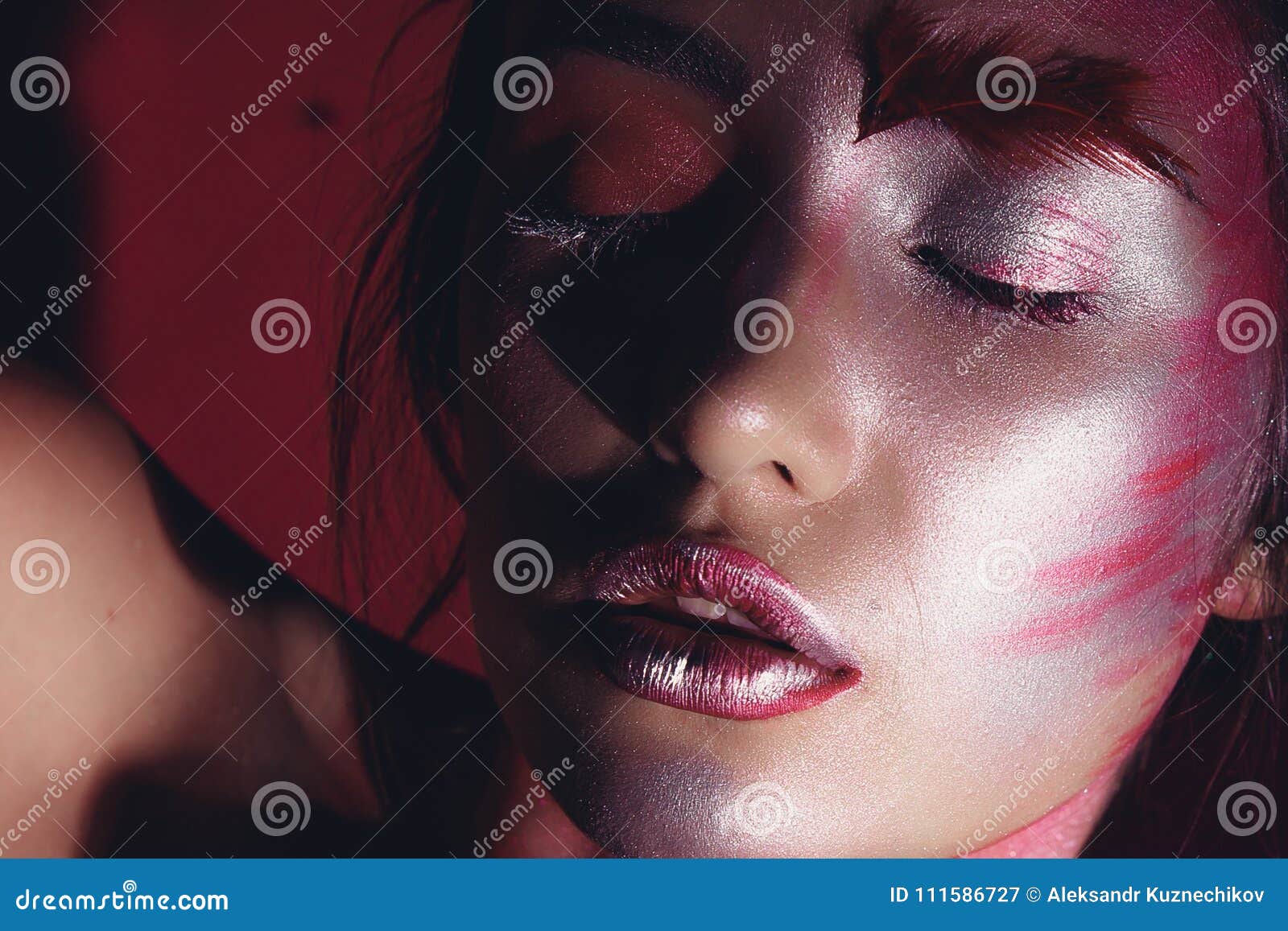 Fashion Portrait Of A Dark Skinned Girl With Silver Foil Make Up