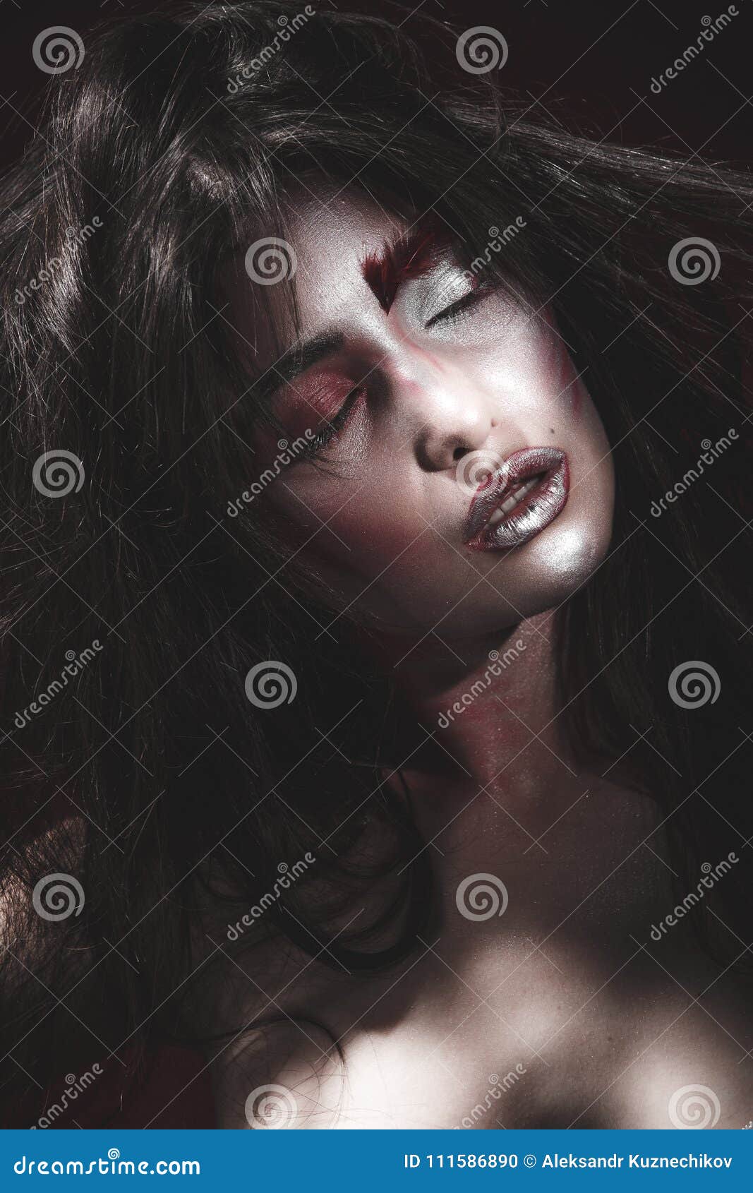Fashion Portrait Of A Dark Skinned Girl With Silver Foil Make Up