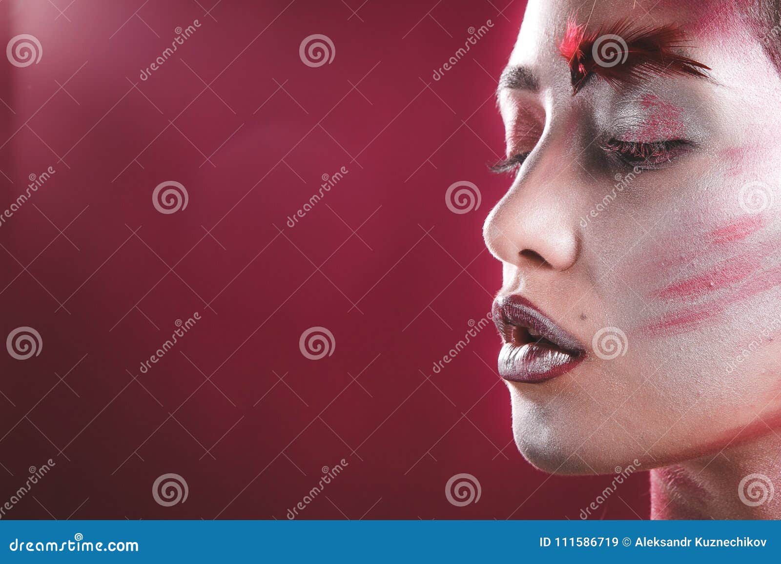 Fashion Portrait Of A Dark Skinned Girl With Silver Foil Make Up