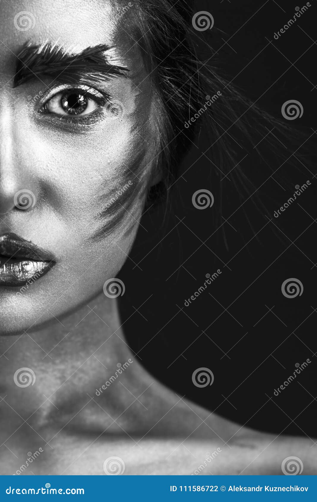 Fashion Portrait Of A Dark Skinned Girl With Silver Foil Make Up