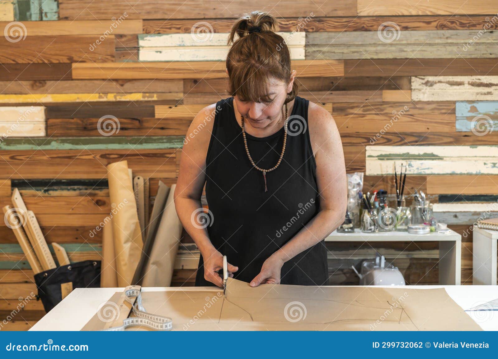 Fashion Designer Cutting Clothes Patterns at Her Studio Stock Photo ...