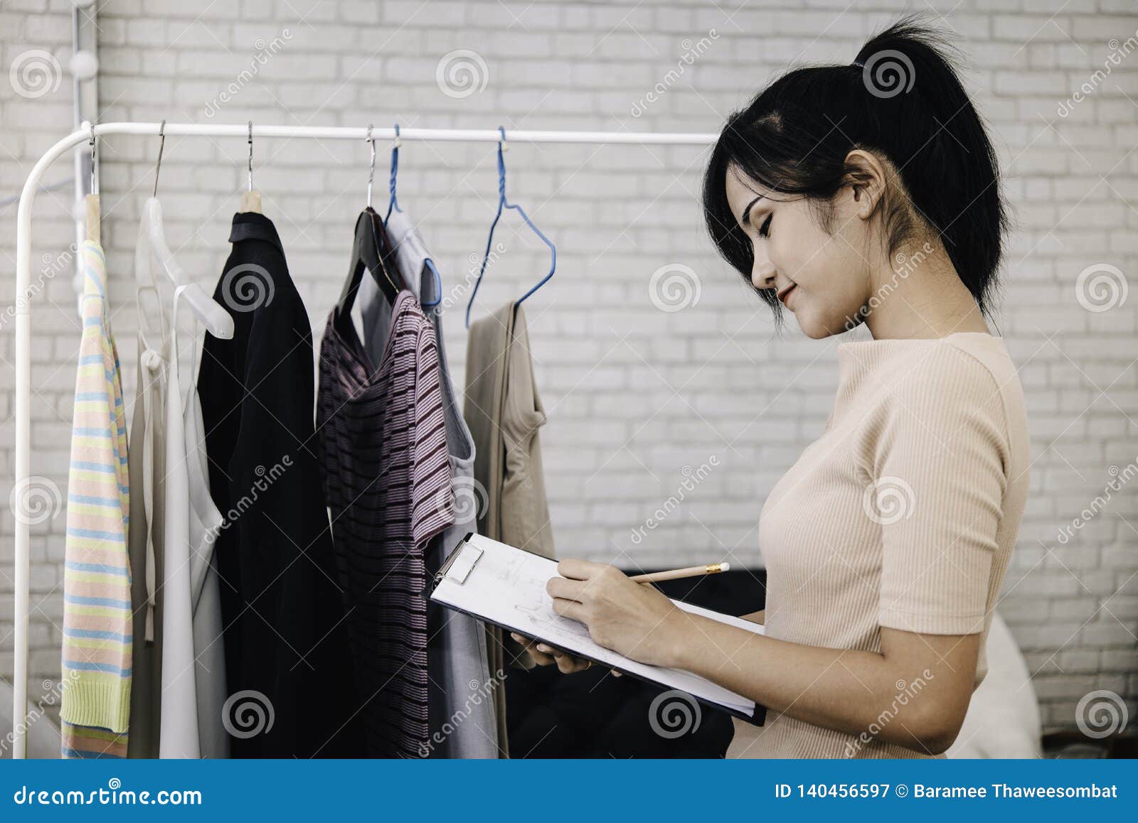 Fashion Designer are Working in Studio Process of Creating New Clothes ...