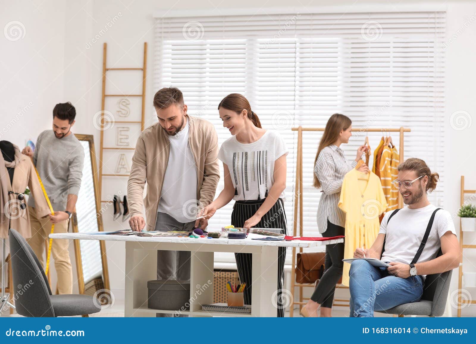 Fashion Designers Creating Clothes in Studio Stock Photo - Image of ...