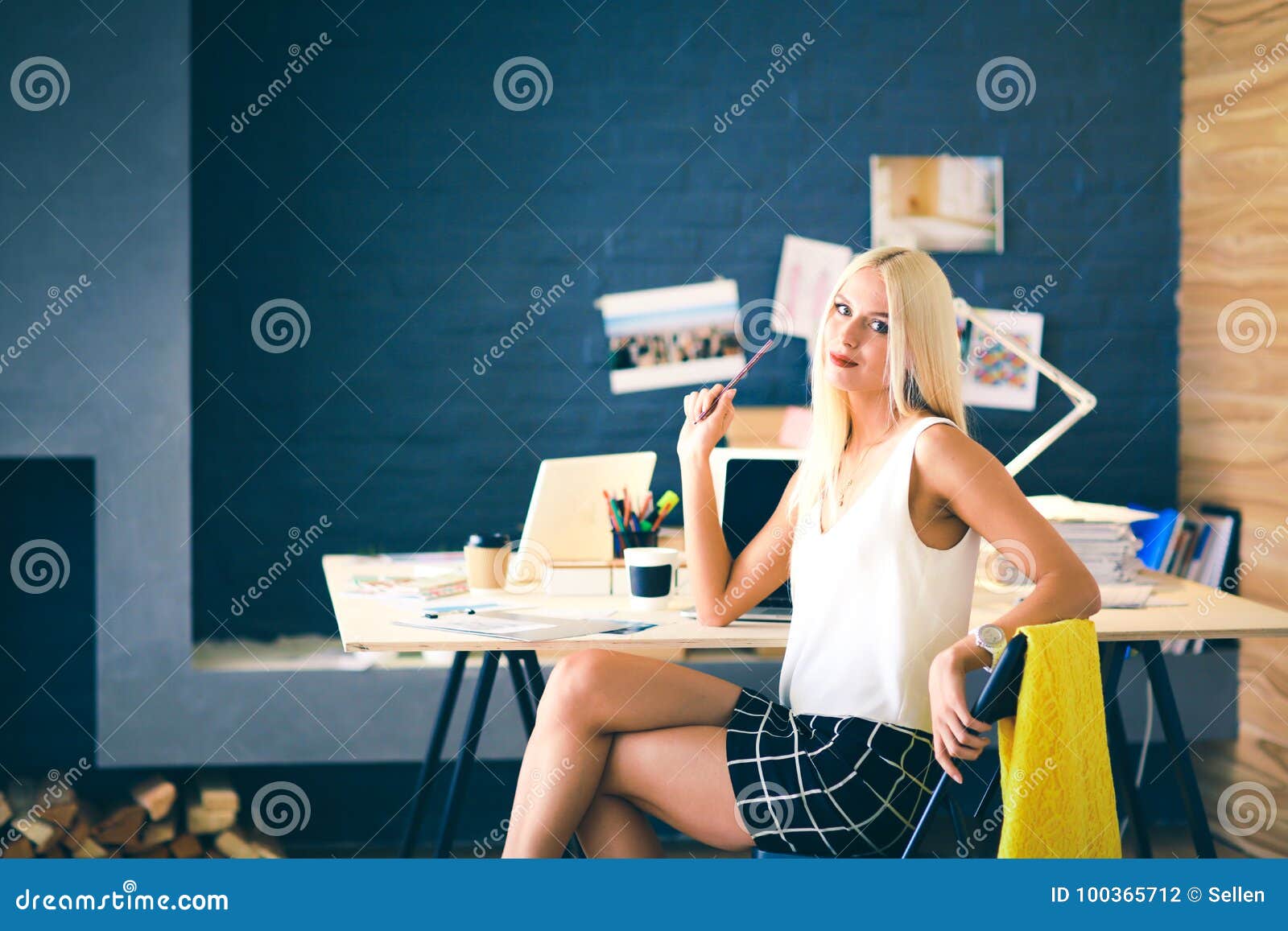 Fashion Designers Working in Studio Sitting on the Desk. Stock Photo ...