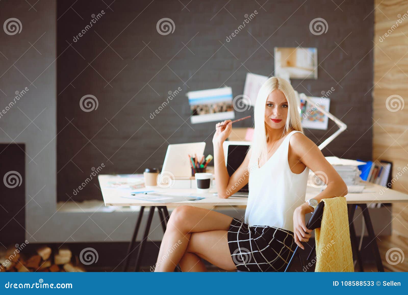 Fashion Designers Working in Studio Sitting on the Desk. Stock Image ...