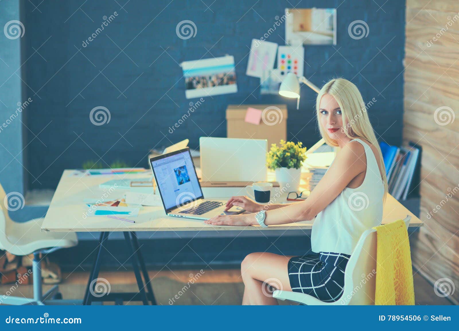 Fashion Designers Working in Studio Sitting on the Desk Stock Photo ...