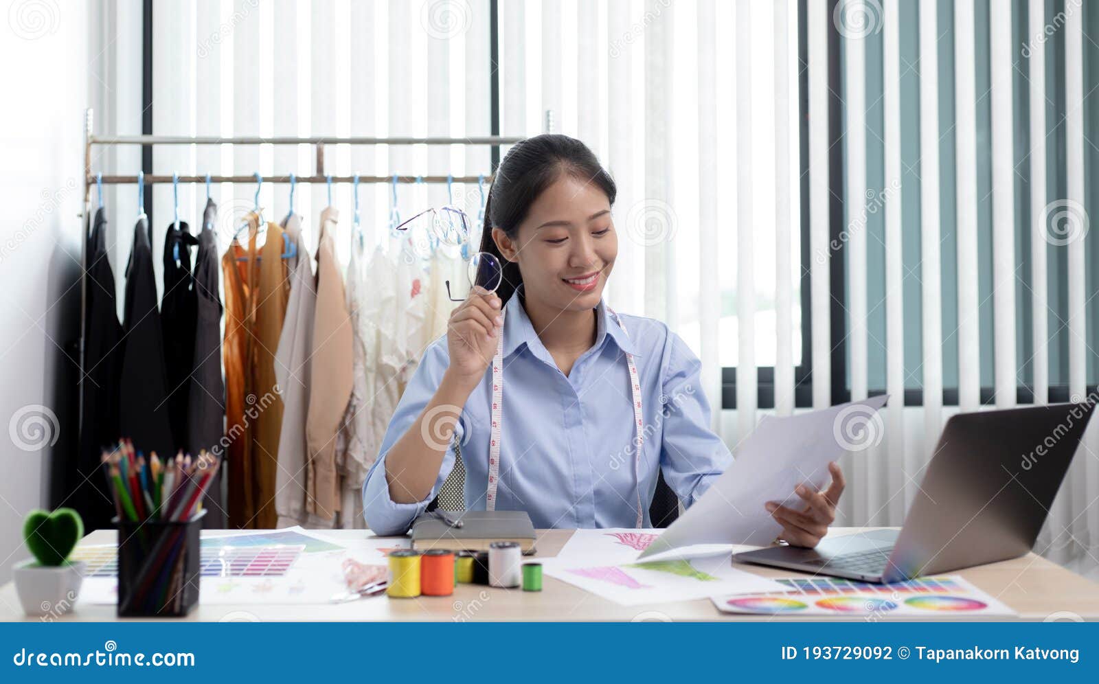 Fashion Designers are Working in Workshops with Laptops and Design ... Fashion Designers are Working in Workshops with Laptops and Design ...