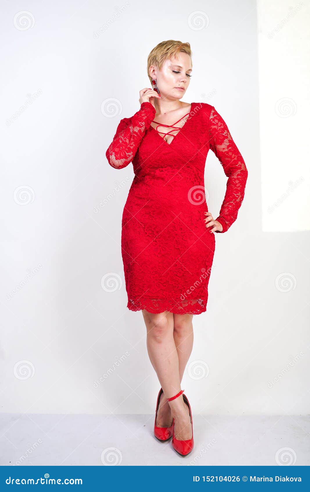 Fashion Female In Red Lace Dress Standing Alone Plus Size Blonde Woman