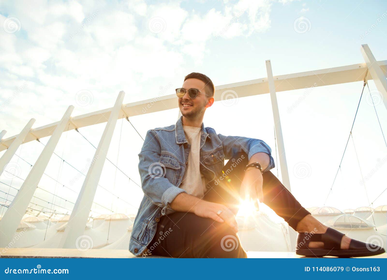 Fashion Guy Sitting at Sunset Posing in Sun Glasses Stock Image - Image ...