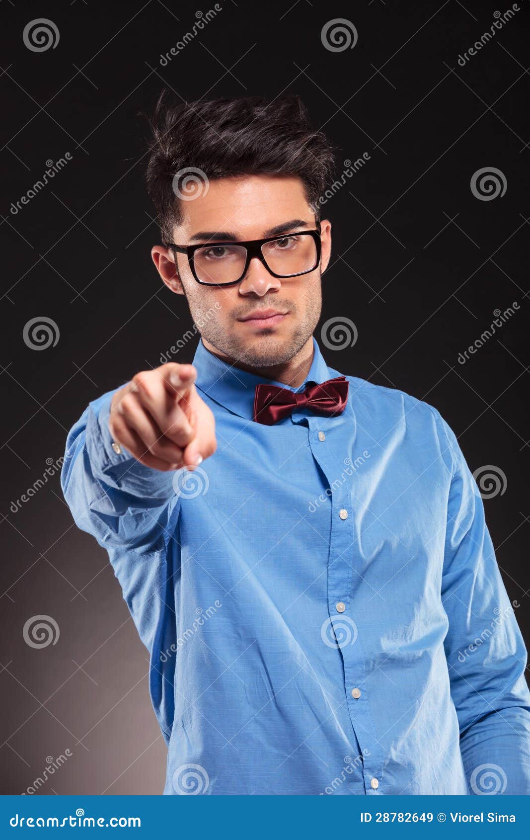 Fashion Man Wearing Bow Tie Pointing Stock Image - Image of blue, grey ...