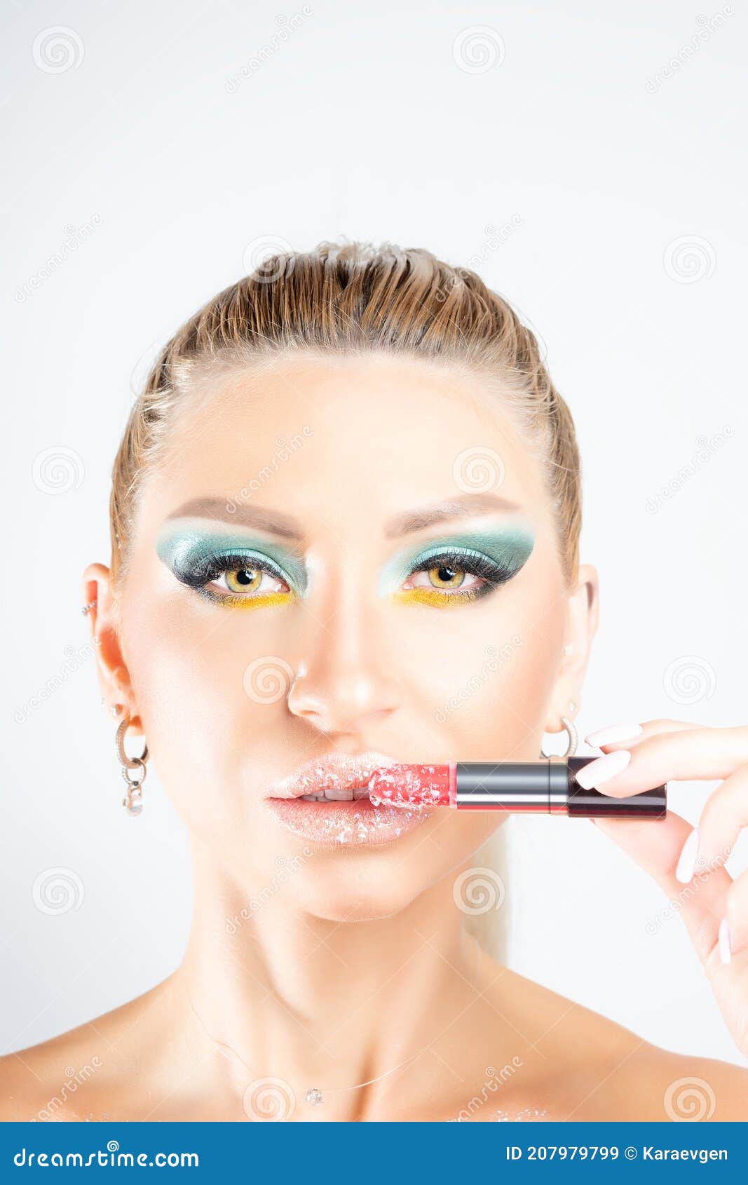 Fashion Model with a Bright Make-up is Using a Lipstick Stock Image ...
