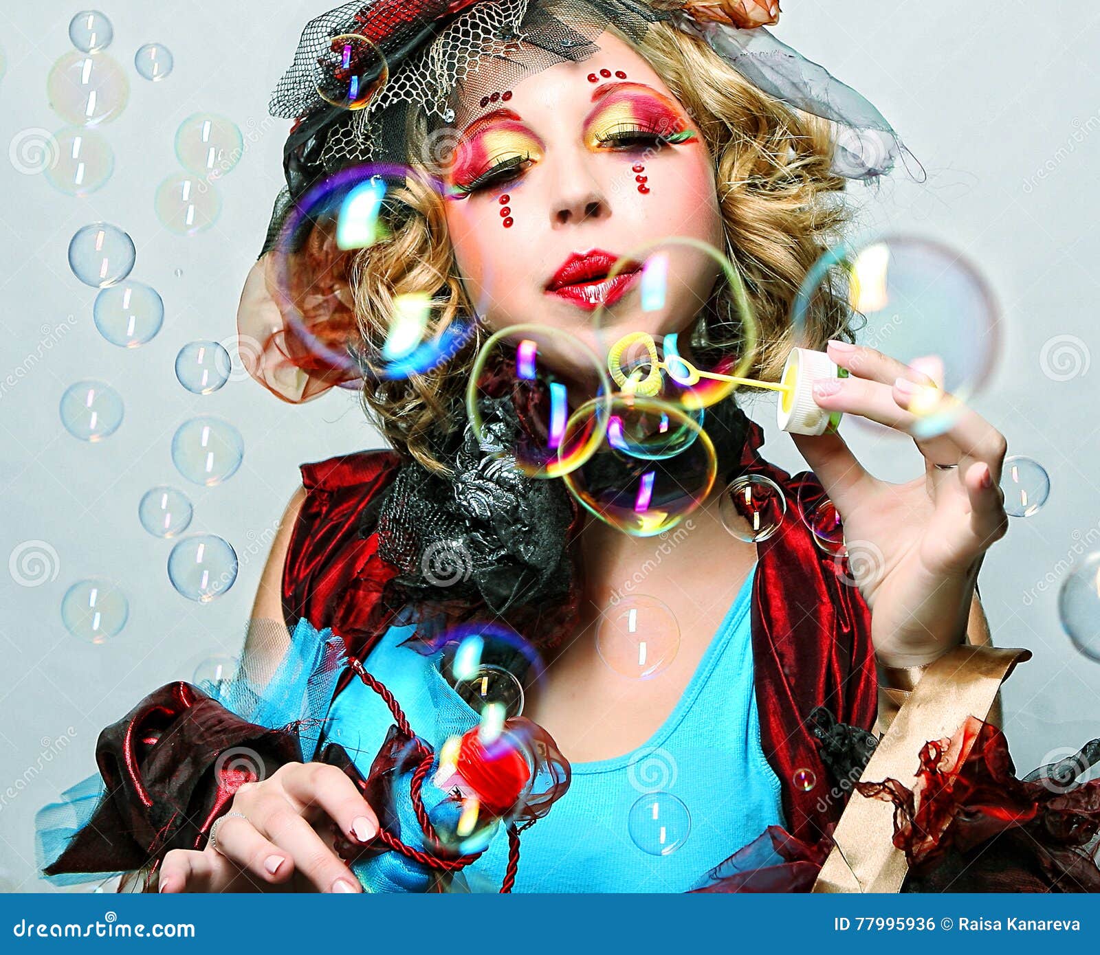Fashion Model with Creative Make-up Blowing Soap Bubbles. Stock Photo ...