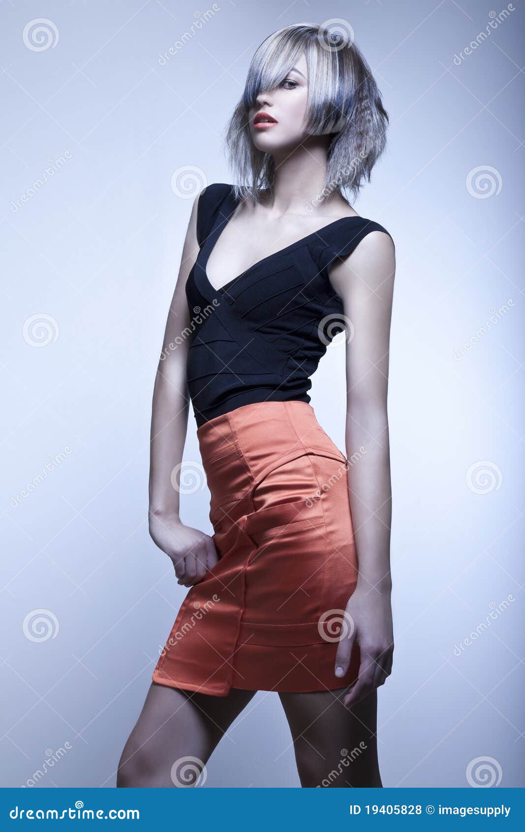 Fashion Model with Edgy Haircut Posing in Studio Stock Photo - Image of ...