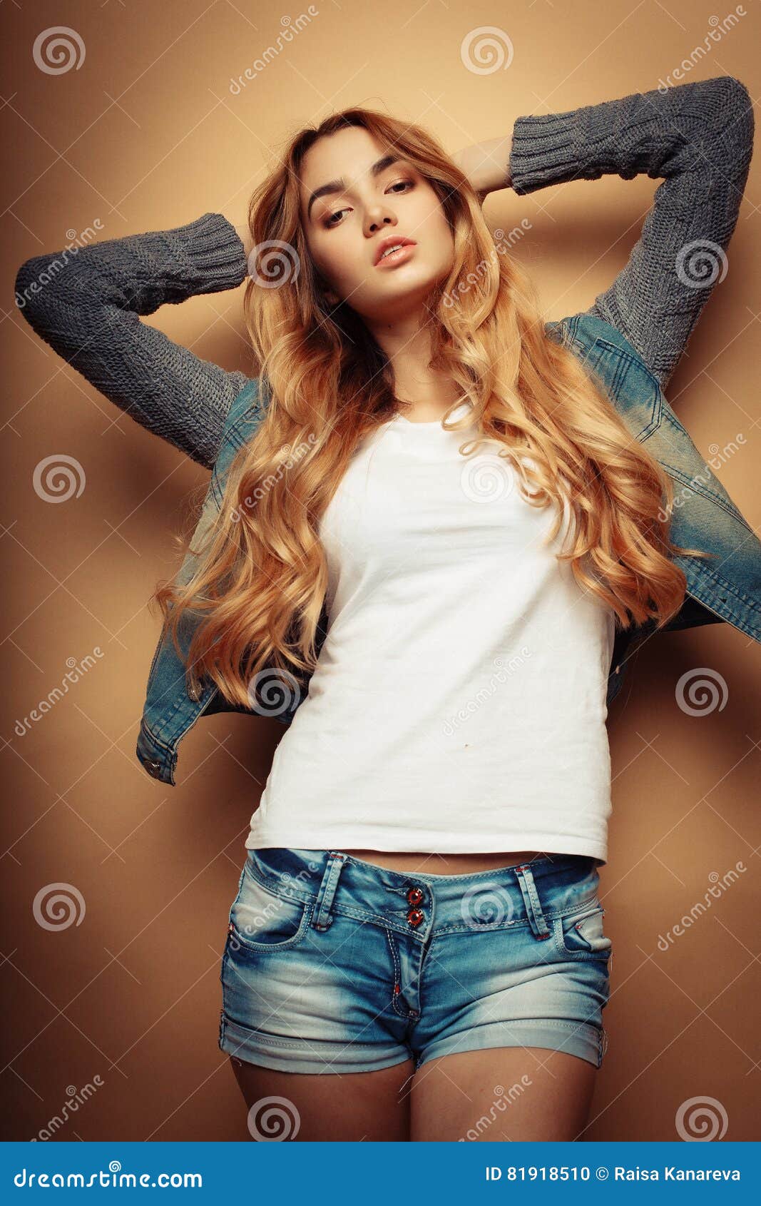 Fashion Model in Nice Clothes Posing in the Studio on Yellow Background ...