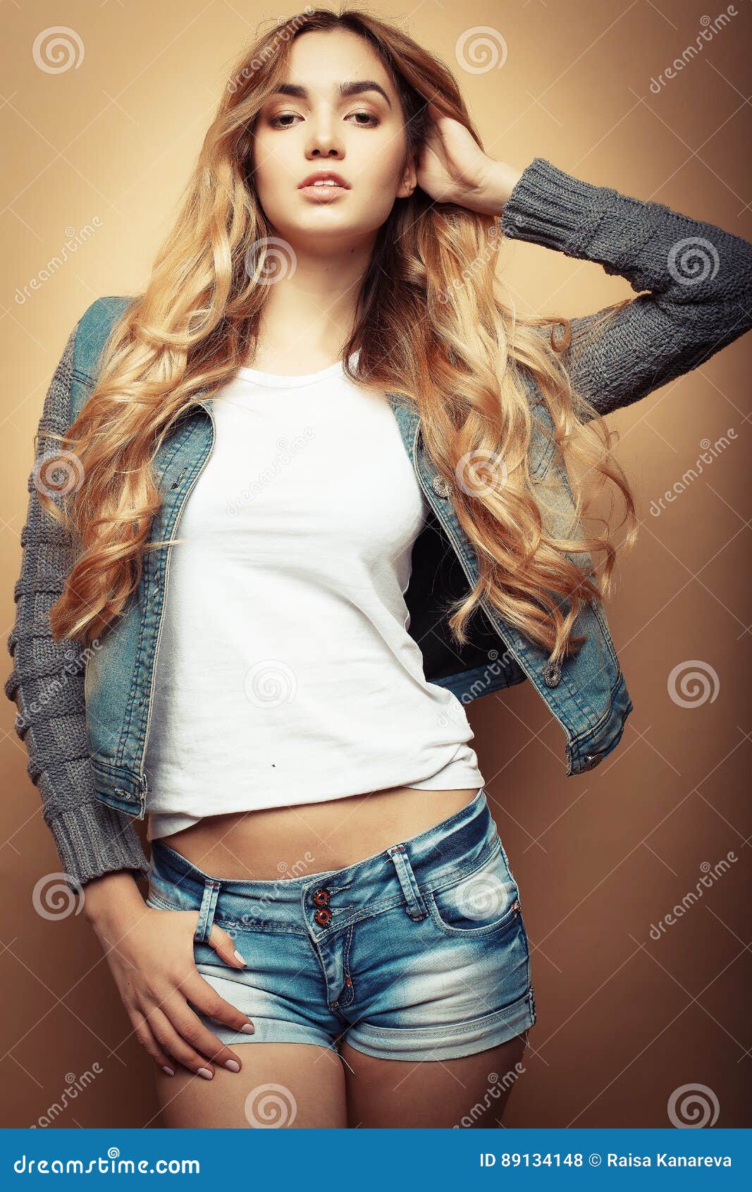 Fashion Model in Nice Clothes Posing in the Studio on Yellow Background ...