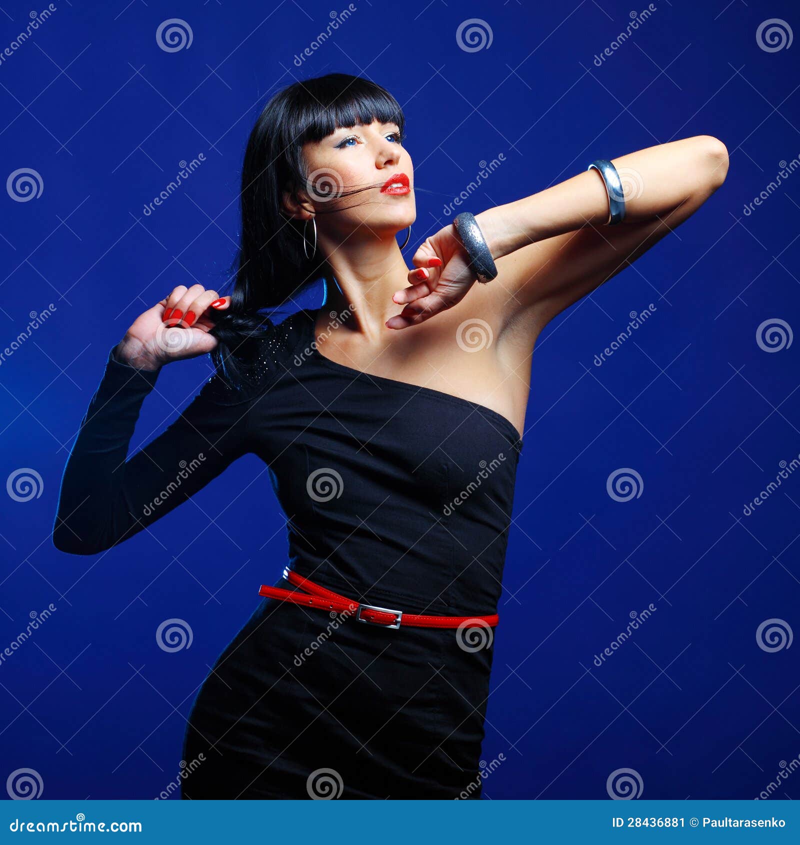 Fashion Model Posing in Studio on a Dark Blue Background Stock Image ...