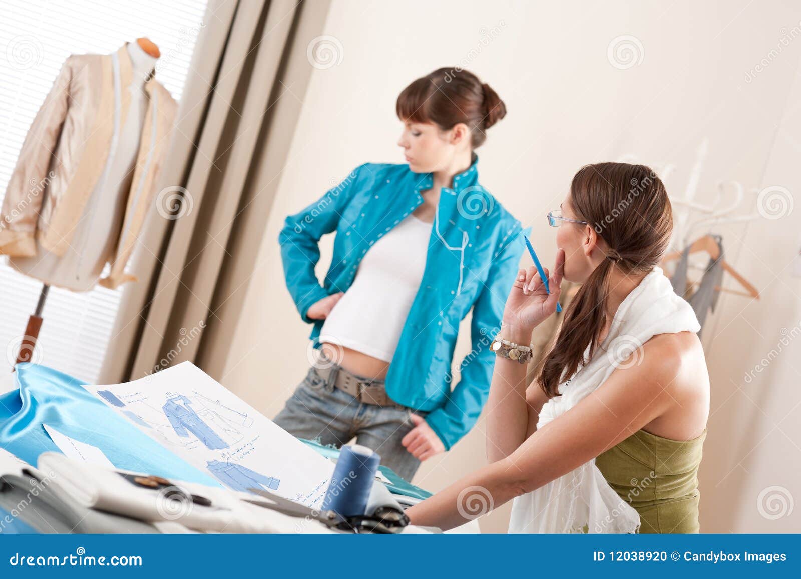 Fashion Model Trying Jacket in Designer Studio Stock Photo - Image of ...