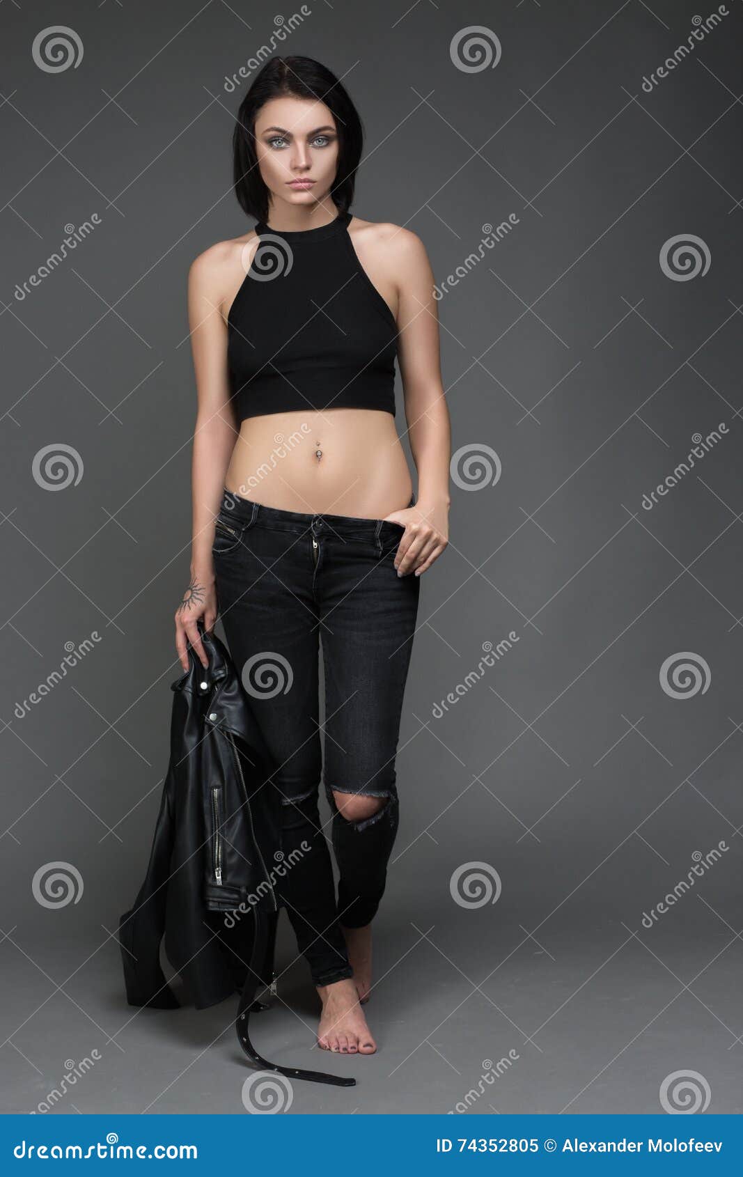 Fashion Model Wearing Leather Pants and Jacket Posing on Grey ...