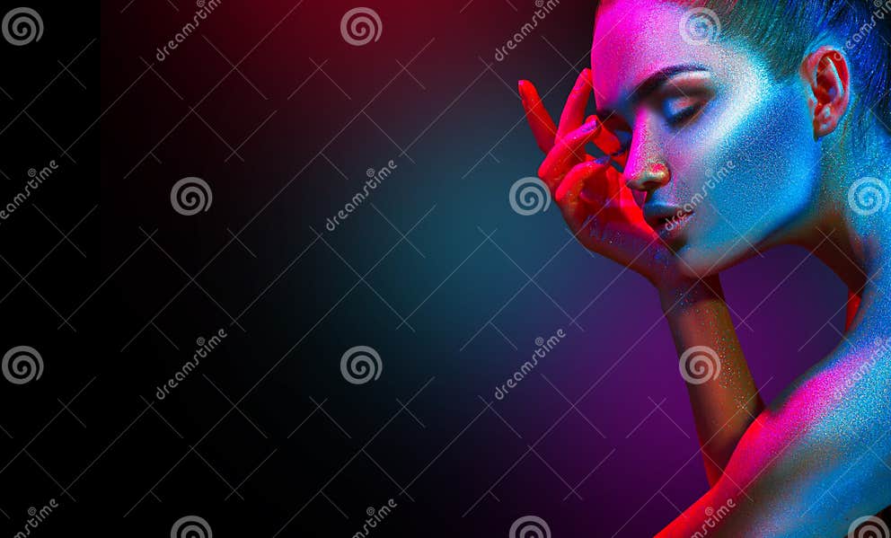 Fashion Model Woman In Colorful Bright Sparkles And Neon Lights Posing