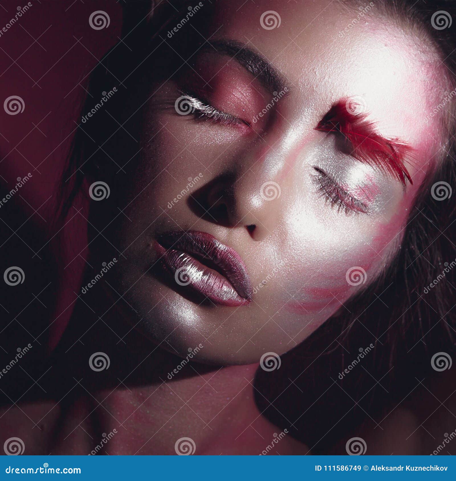 Fashion Portrait Of A Dark Skinned Girl With Silver Foil Make Up