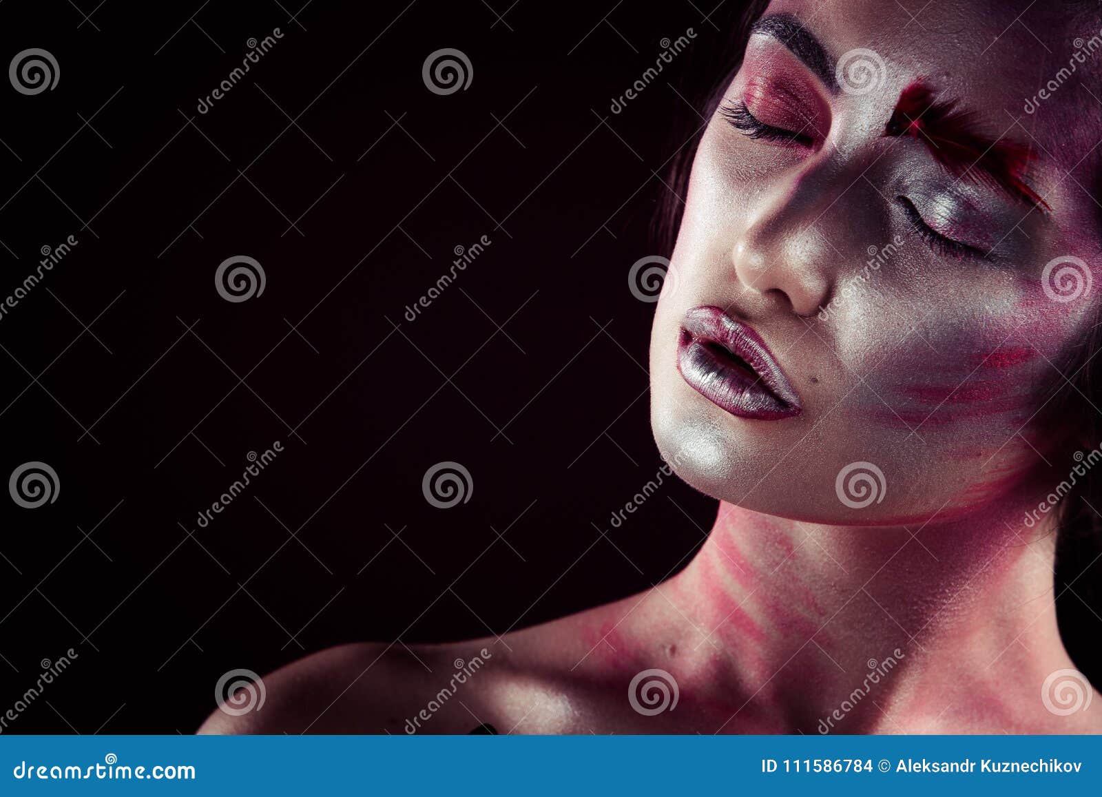 Fashion Portrait Of A Dark Skinned Girl With Silver Foil Make Up