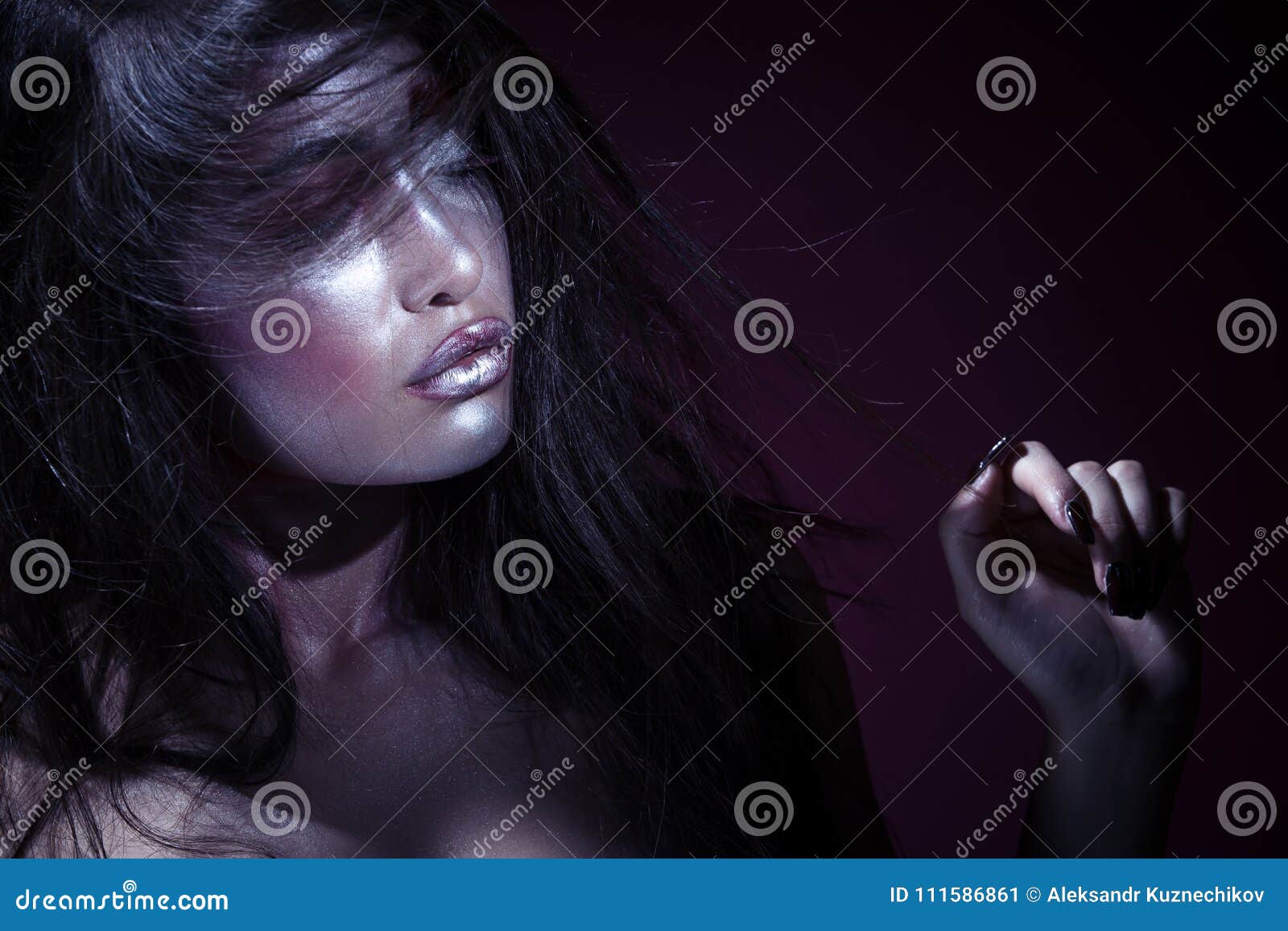 Fashion Portrait Of A Dark Skinned Girl With Silver Foil Make Up