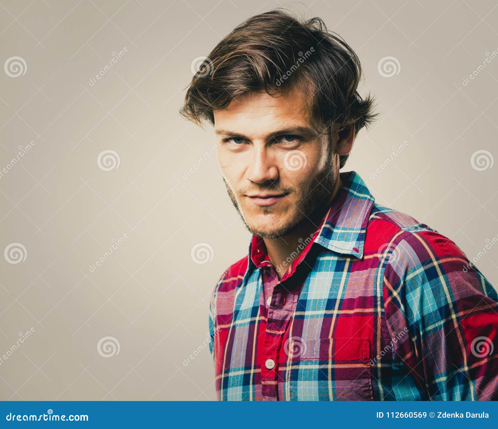 Caucasian Man Wearing Checkered Shirt And Trendy Hairstyle Stock Image